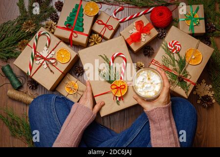 Cup with marshmallow and xmas gift boxes. Christmas holiday with ...