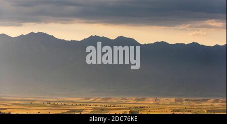 Sun on the fields near Karakol and Issyk Kul in Kyrgyzstan Stock Photo ...