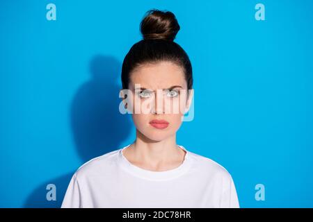Gloomy dissatisfied brunette girl, student in casual outfit against ...