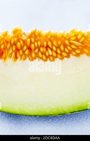 closeup sliced ripe orange muskmelon with mint and knife isolated on ...