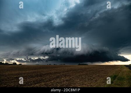 Supercell thunderstorm with rotating wallcloud over the countryside of ...