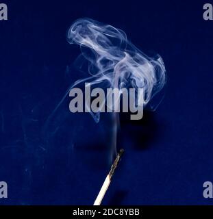 smoke trailing off matchstick on fire Stock Photo - Alamy