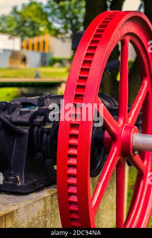 Closeup view of an old iron flywheel Stock Photo - Alamy