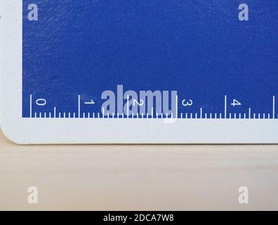 paper ruler with metric units in white over blue Stock Photo - Alamy