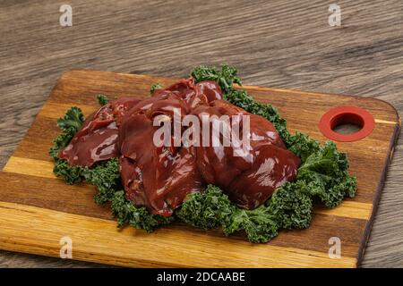 Raw chicken liver over board for cooking Stock Photo - Alamy