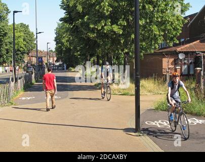 Cyclists and pedestrians use a new, segregated crossing on Lea Bridge ...