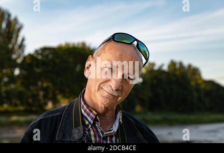 Life style concept. Old man. Portrait of a wise, skeptical and tired of ...