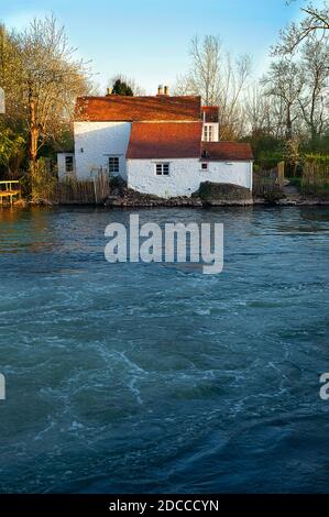 Old water mill with fast flowing water at the source of the River Gacka ...
