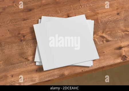 Square white magazine or brochure stack mockup on white table Stock ...