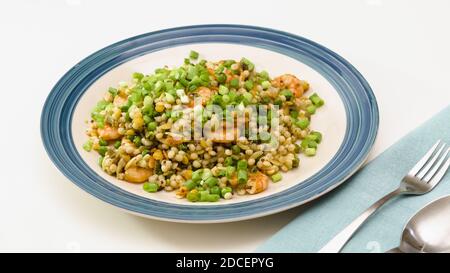 Blend of couscous, orzo, garbanzo beans, red quinoa cooked with shrimps ...