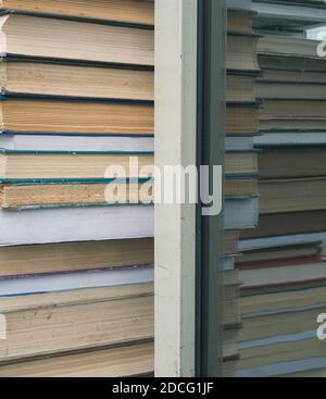 Old books on a row, old window Stock Photo - Alamy