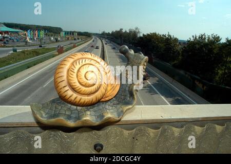 driving with snail pace on the highway, speed limit on the road snail ...