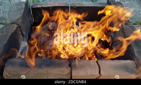 Fire is flaming in windy weather. Blazing bonfire closeup. Picnic ...
