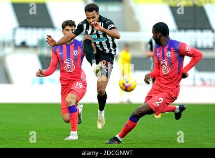 Newcastle United's Jacob Murphy (centre) sits on the floor after ...