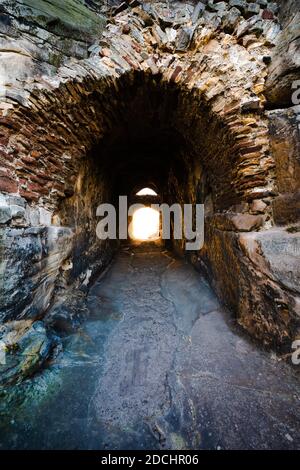 Small cave in mountain. Dark enter. Abstract nature photo Stock Photo ...