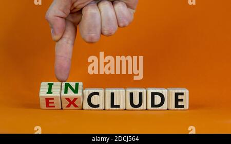 Symbol for a better inclusion. Male hand turns cubes and changes word ...