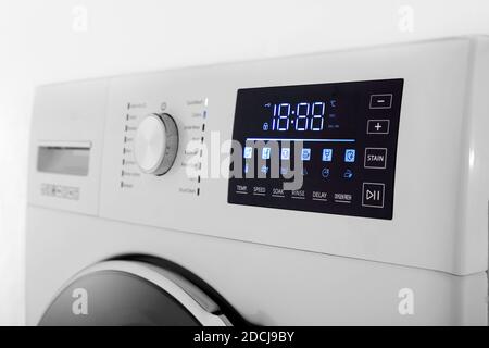 Details of digital display and washing machine volume on white ...