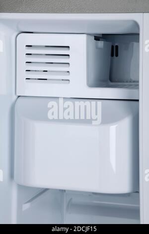Closeup view of the home refrigerator ice maker Stock Photo - Alamy