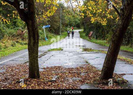 A pair of cyclists ride along the Bristol and Bath Railway Path during ...