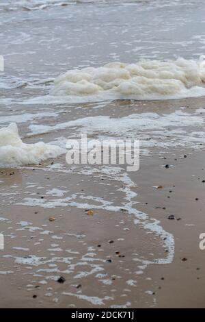 Foaming sea waves wash the coastal cliffs Stock Photo - Alamy