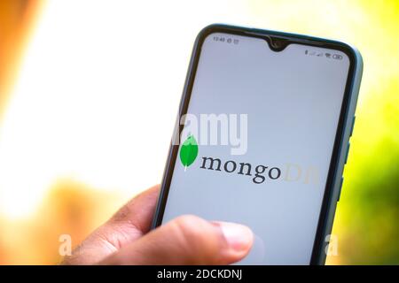 In this photo illustration, a MongoDB logo is seen displayed on a smartphone and in the ...