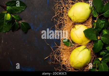 Large Yellow Quince With Leaves, Rustic Style, Top View Stock Photo - Alamy