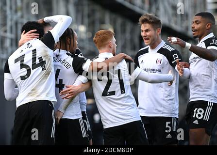 Fulham's Joachim Andersen (second right) misses a chance during the ...