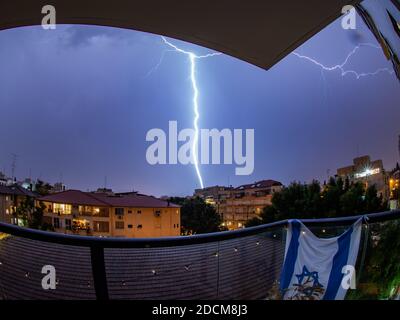 Dramatic view of bright lightning in gloomy cloudy sky flashing above ...