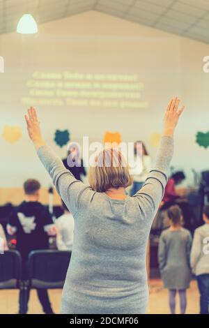 Concert crowd, hands up, toned Stock Photo - Alamy