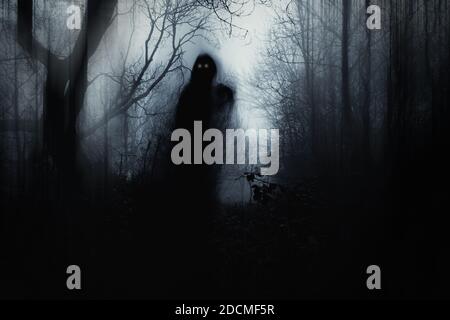 A scary, hooded figure with glowing evil eyes and blank black space ...