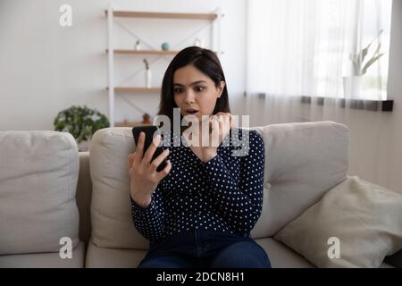 Unhappy, Confused Mixed Race Young Female Talking on Cell Phone Outside ...