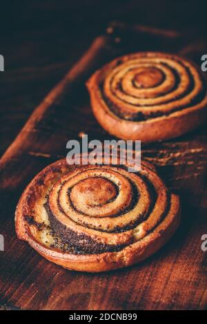 Poppy seeds baked roll bun isolated on white background Stock Photo - Alamy