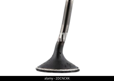 Warped engine valve stem, covered with soot, isolated on a white ...