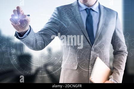 Businessman hand draws gear to success concept Stock Photo - Alamy