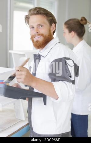 painter men mixing paint at work Stock Photo - Alamy