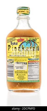A glass bottle of Suka Pinakurat, a spiced vinegar produced in Iligan ...