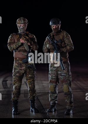 Soldiers squad in night mission Stock Photo - Alamy