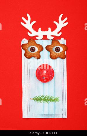 medical mask with deer antlers on a red background. High quality photo ...