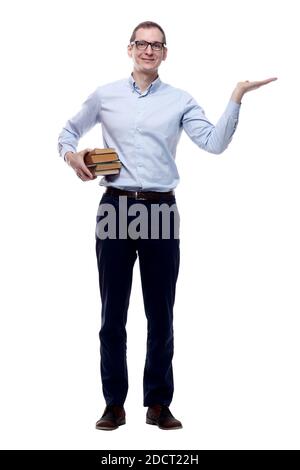 Man pointing at a pile of books and people sitting in school chairs in ...