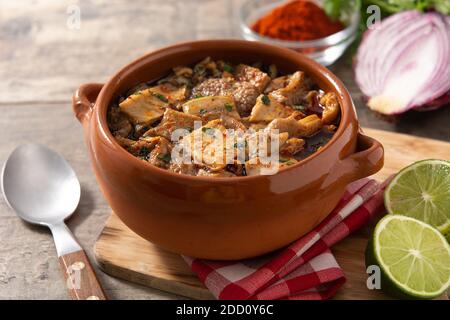 Traditional mondongo or el menudo soup on wooden table Stock Photo - Alamy