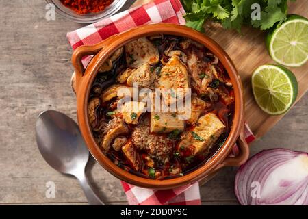 Traditional mondongo or el menudo soup on wooden table Stock Photo - Alamy