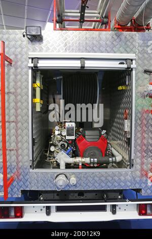 The rear of fire truck with water pump equipment Stock Photo - Alamy