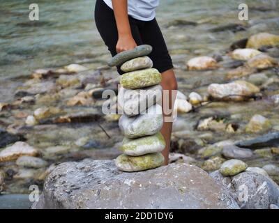 A closeup of various stones stacked up on each other on another huge ...
