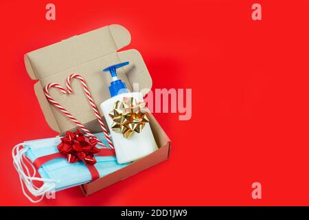 Disposable face masks and gift box on white background with copy space ...
