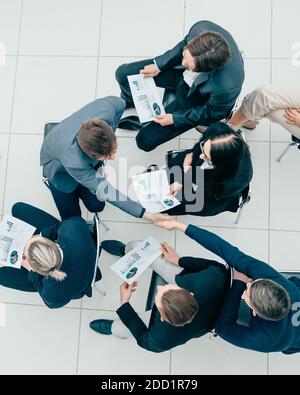 business colleagues supporting each other with a handshake Stock Photo ...