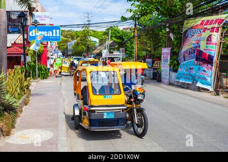 BORACAY, PHILIPPINES - MARCH 04, 2013: Tricycle at the main street in ...