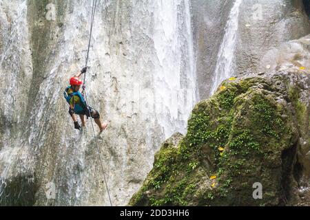 Filipino waterfall rapelling in Bicol, Philippines Stock Photo - Alamy