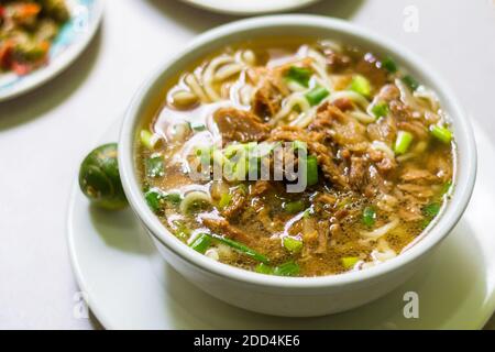 Filipino noodle soup called mami at a local restaurant in Tacloban City ...
