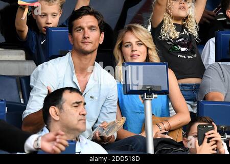 Lionel Erdogan and Claire Arnoux watch from the stands Paris Saint ...