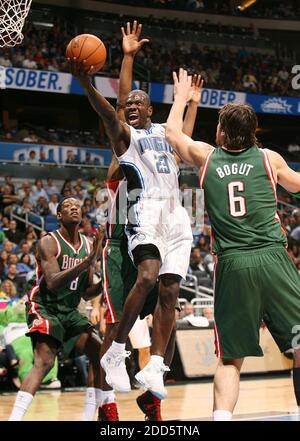 Orlando Magic guard Jason Richardson, right, lays in a basket as he ...